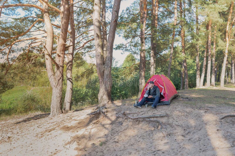 Man Resting on the Campsite Reading a Book Stock Image - Image of male ...