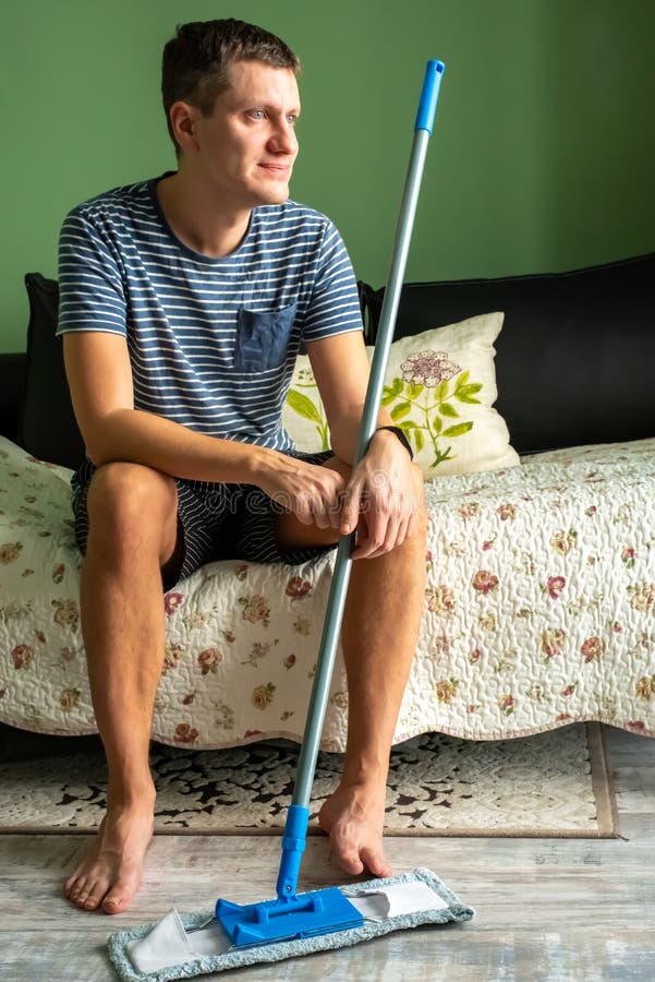 A Man is Resting after Cleaning the Apartment Stock Photo - Image of ...