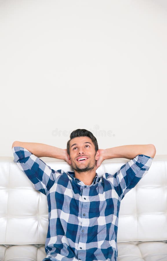 Man resting on the coach stock photo. Image of young - 60038860