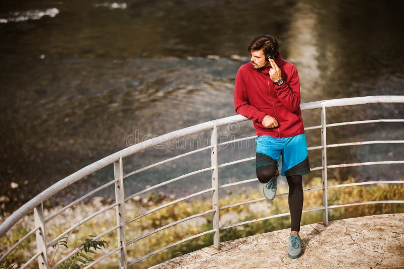 Young Male Athlete Taking a Break from Running Stock Photo - Image of ...