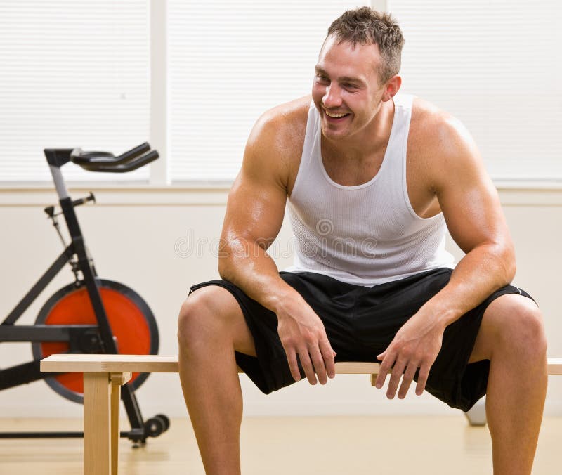 Man Riding Stationary Bicycle in Health Club Stock Photo - Image of ...
