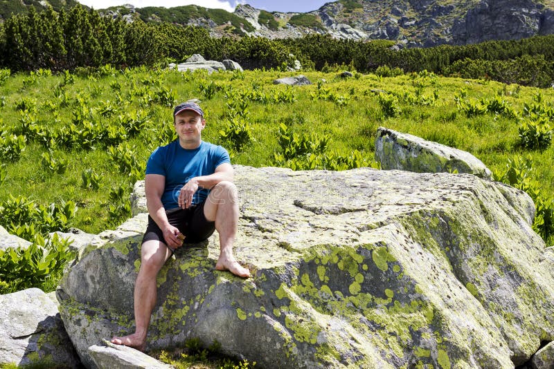 Man Resting after Hiking on Mountains Stock Photo - Image of boulders ...