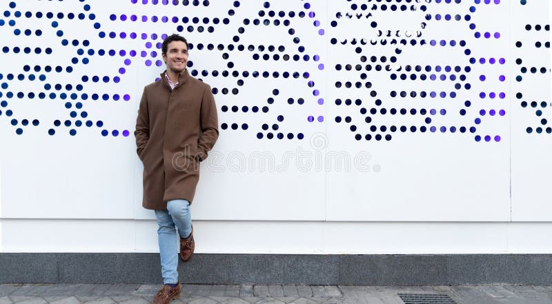 Man Resting on a White Wall with Circles of Light Stock Photo - Image ...