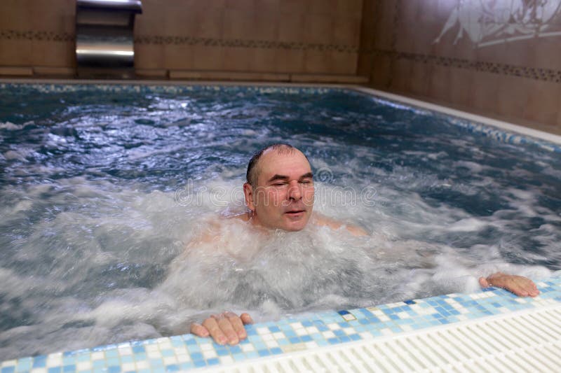 Man resting in jacuzzi stock photo. Image of face, bubble - 25298752