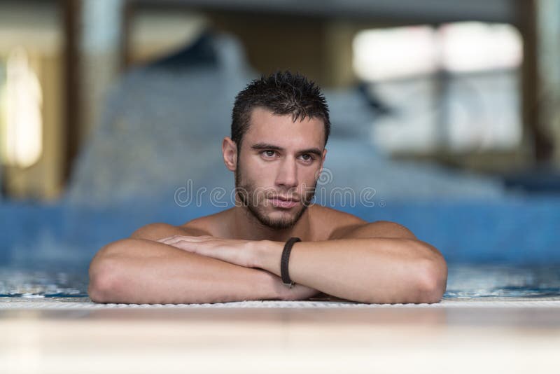 Man Resting Relaxed on Edge of Swimming Pool Stock Photo - Image of ...
