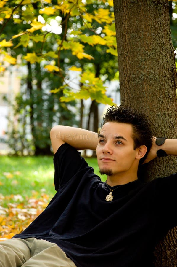 Man resting under a tree stock image. Image of healthiness - 27279871