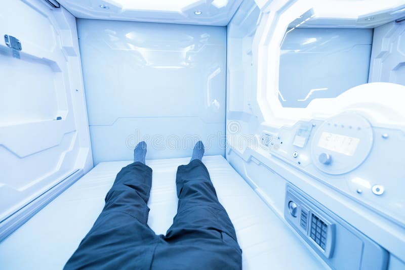Man Rests and Sleeps in a Capsule Hotel View from the Inside. the ...