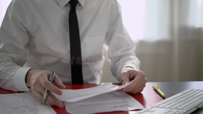 Man Reviewing Paperwork at His Desk Stock Video - Video of businessman ...