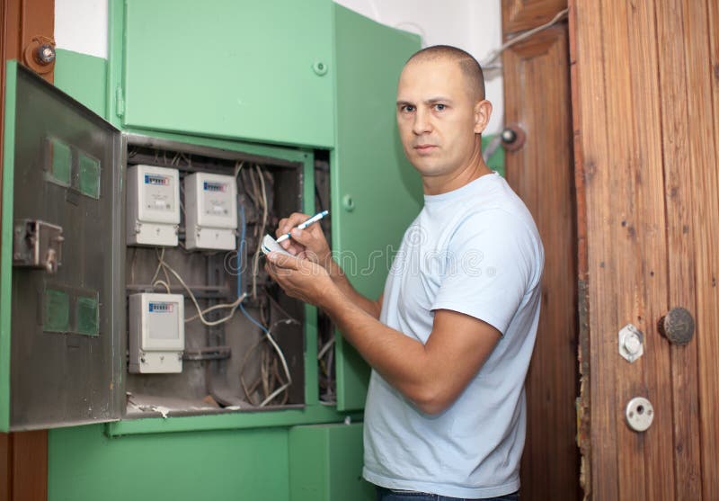 Man Rewrites Electric Power Meter Readings Stock Photo - Image of ...