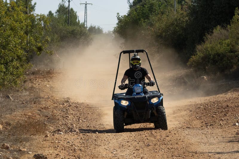 A Man Riding an ATV on a Forest Road Editorial Stock Photo - Image of ...