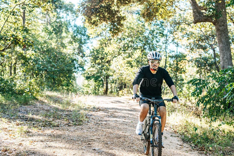 The Man Riding a Bike in a Mountain Path Stock Photo - Image of bicycle ...