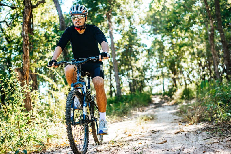 The Man Riding a Bike in a Mountain Path Stock Image - Image of ...