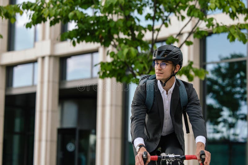 Man Riding a Bike in the Office Area Stock Photo - Image of cycling ...