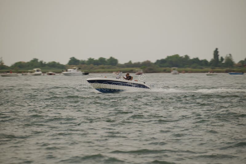 Man Riding a Boat in Venetian Lagoon Editorial Image - Image of riding ...