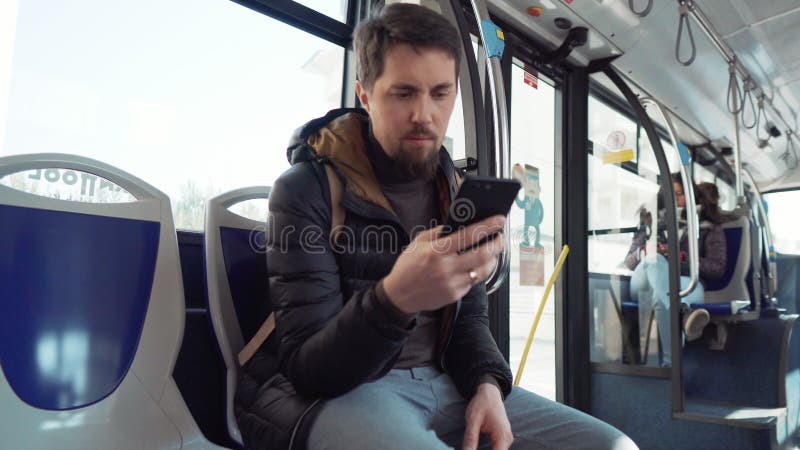 Man is Riding Bus and Looking on Screen of Smartphone Stock Video ...