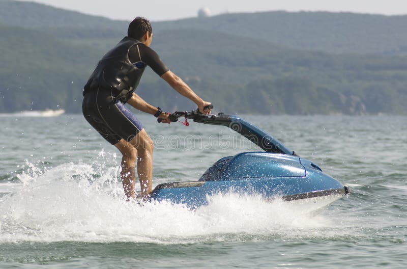 Man riding a jet ski stock image. Image of male, tourist - 27791133