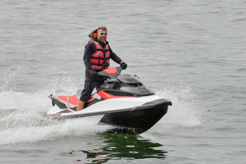 Man riding a jet ski stock image. Image of ride, riding - 123823013