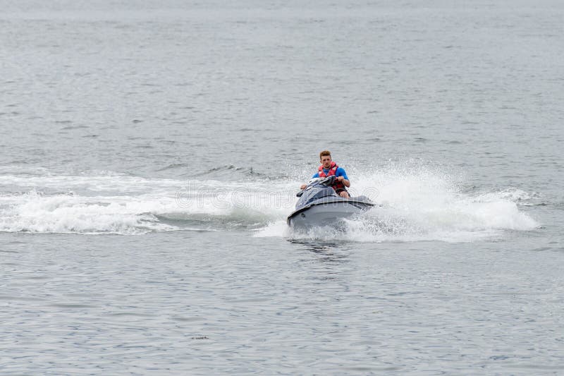 Man riding a jet ski stock photo. Image of adult, jump - 123978418