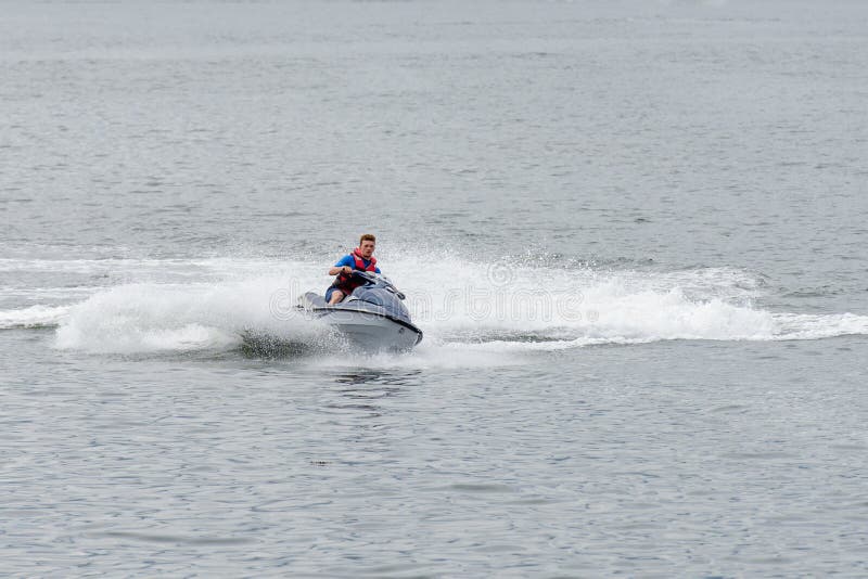Man riding a jet ski stock image. Image of action, ride - 123978433