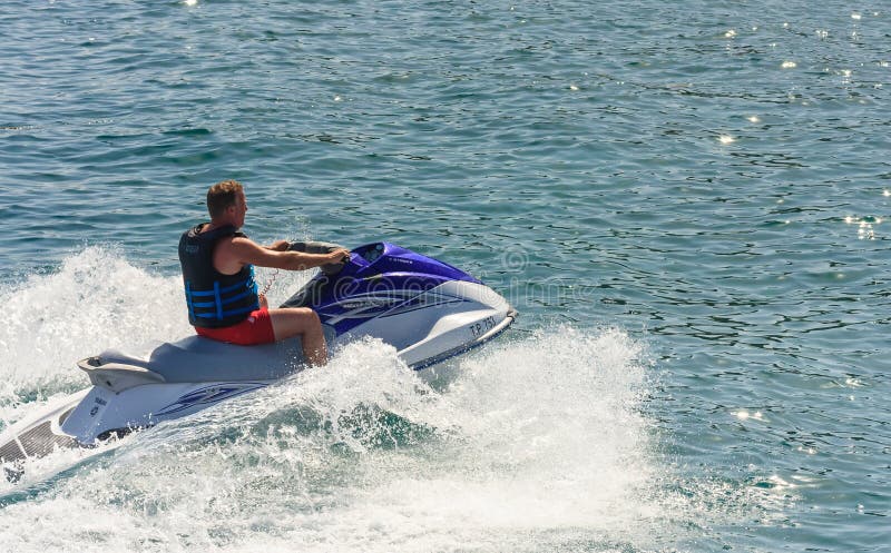 A Man Riding a Jet Ski (scooter) Editorial Image - Image of motion ...