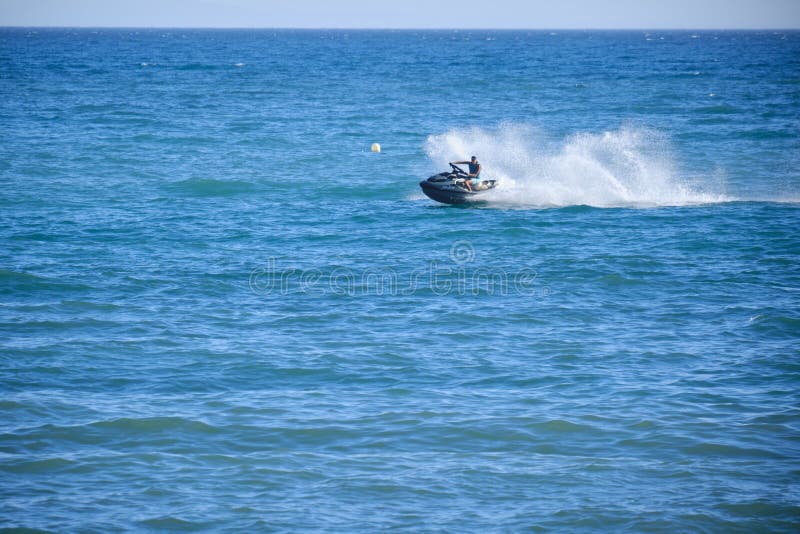 Man Riding a Jet Ski on a Sunny Day Stock Image - Image of adult ...