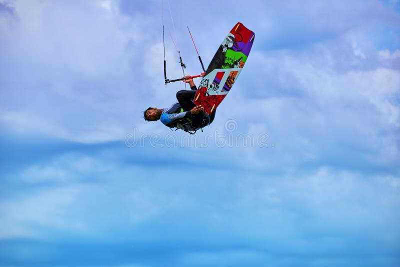 Man Riding a Kite Surfing on the Waves in the Summer. Editorial Image ...