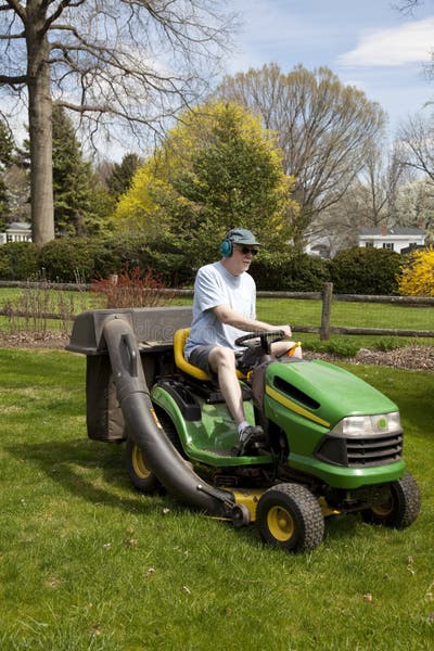 Man on Riding Lawn Mower editorial photo. Image of grass - 9034291