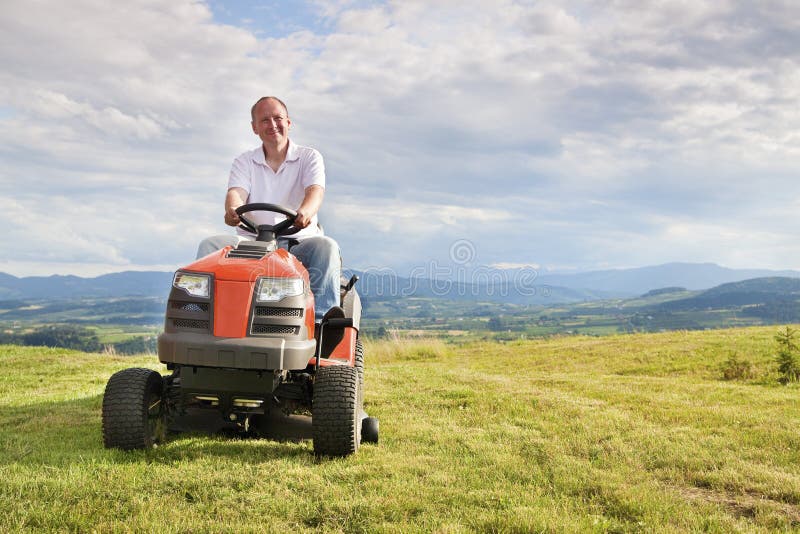 Man riding a lawn tractor stock image. Image of service - 25852987