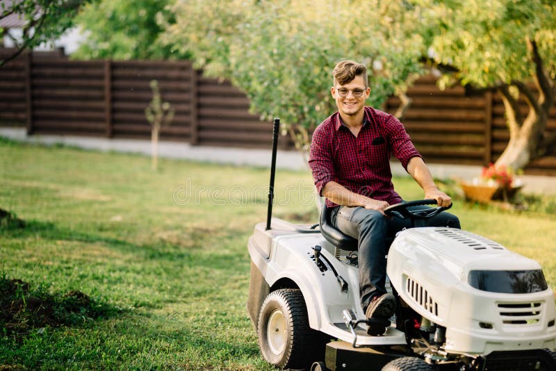 Man Riding a Lawnmower and Doing Landscaping Works Stock Image - Image ...
