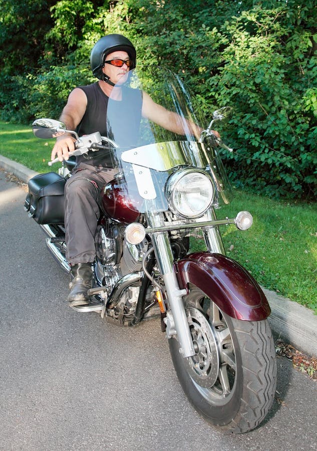 Man Riding Motorcycle stock image. Image of male, person - 10792777