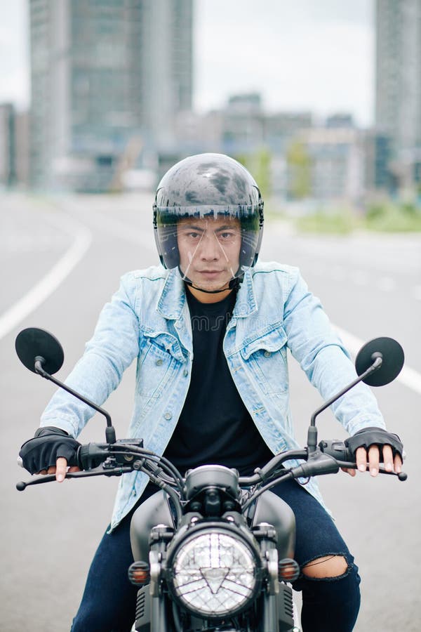 Man riding on motorcycle stock image. Image of road - 194326909
