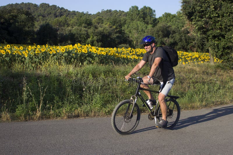 Man riding mountain bike stock photo. Image of traveling - 21731120