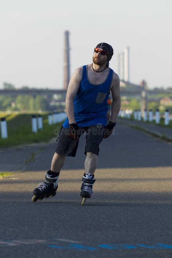 A Man Riding on Roller Skates in the City Stock Image - Image of ...