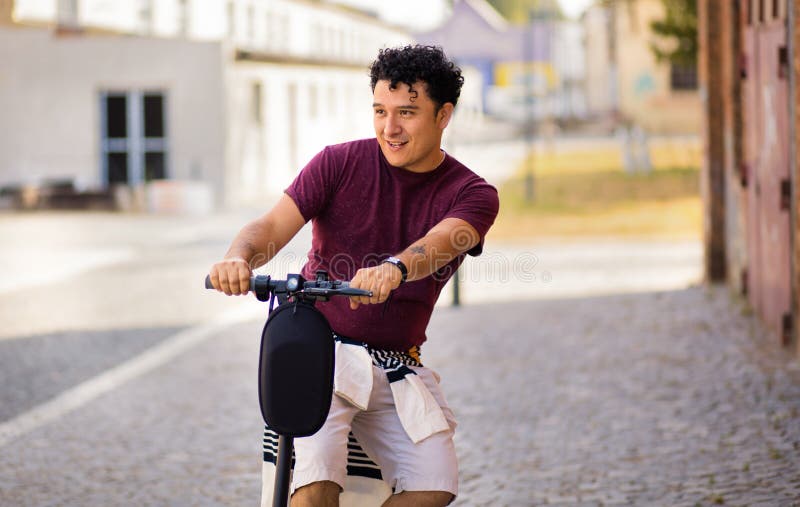 Man Riding Scooter on the Street Stock Image - Image of park, scooter ...