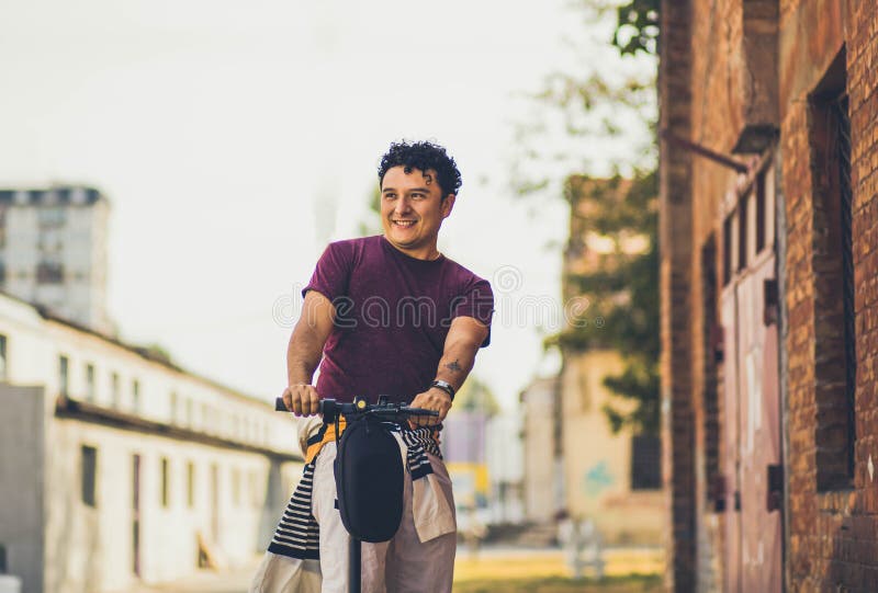 Man Riding Scooter on the Street Stock Image - Image of city, happiness ...