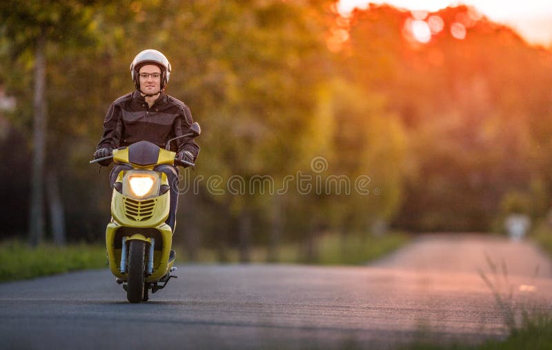 Man Riding Scooter during Sunset. Stock Image - Image of extreme ...