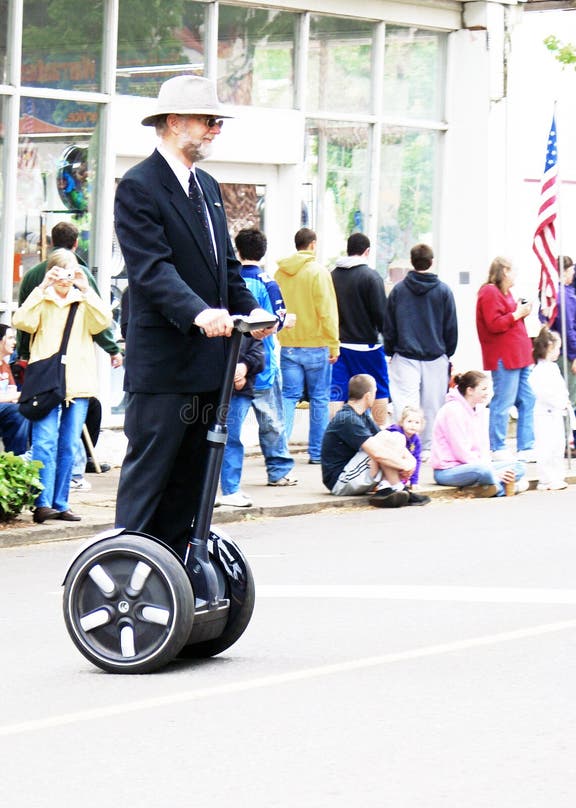 Man riding a Segway editorial photo. Image of business - 19750321