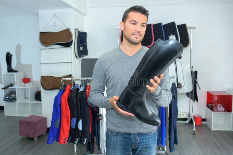 Man in riding shop stock image. Image of showroom, customer - 277791811