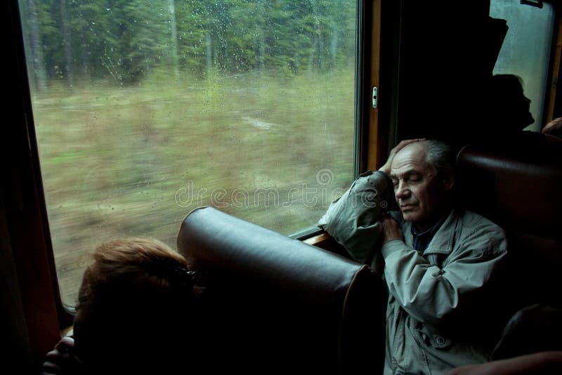 Man is riding in a train editorial stock photo. Image of elderly ...
