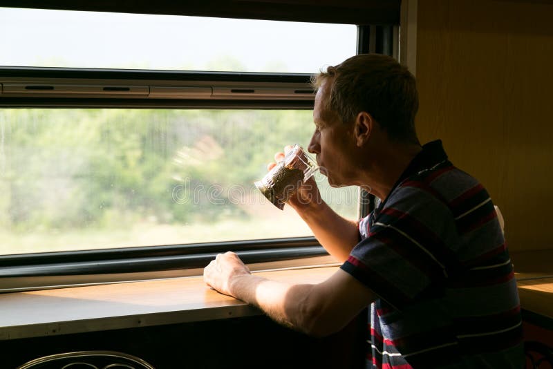 A Man is Riding in a Train Restaurant Car. Stock Image - Image of ...