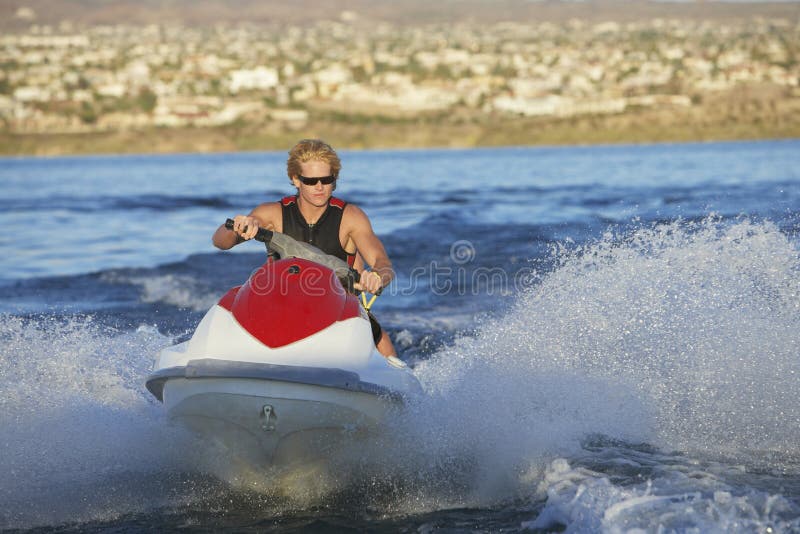 Man Riding Water Scooter stock image. Image of personal - 29658193