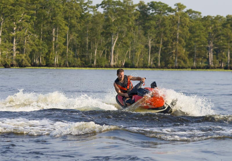 Man on Wave Runner on the Water Stock Image - Image of speed, jetski ...