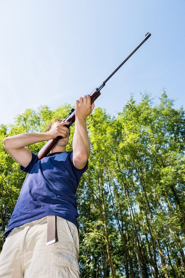 Man with Rifle Hunting in Forest Stock Photo - Image of summer ...