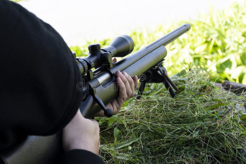 Man with a Rifle Looking through the Scope Stock Image - Image of green ...