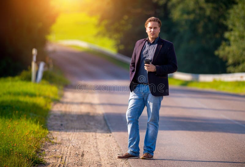 Man on a road, sunshine stock image. Image of adventure - 81348299