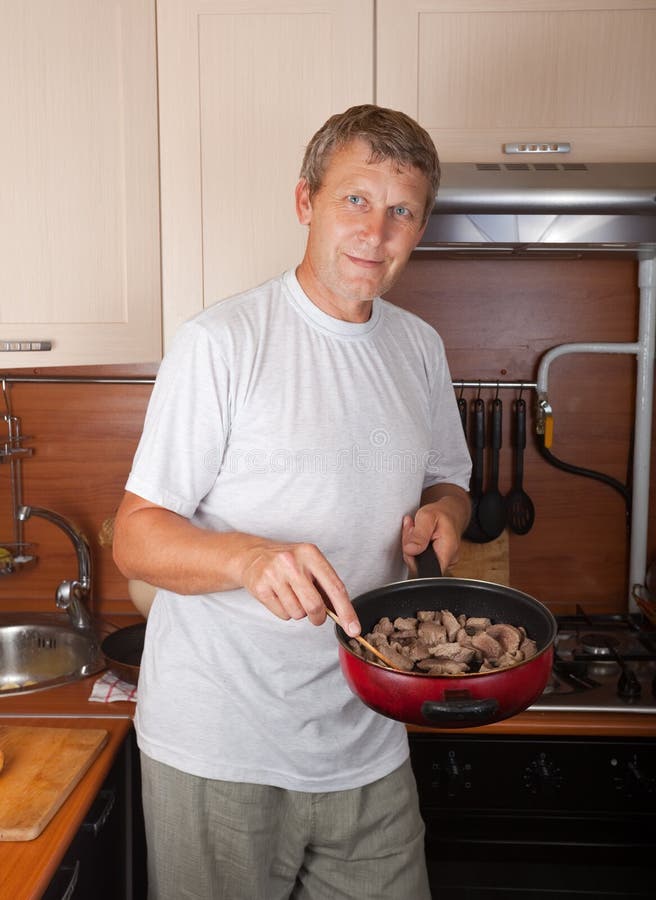 Man roasting meat stock photo. Image of meal, person - 23864554