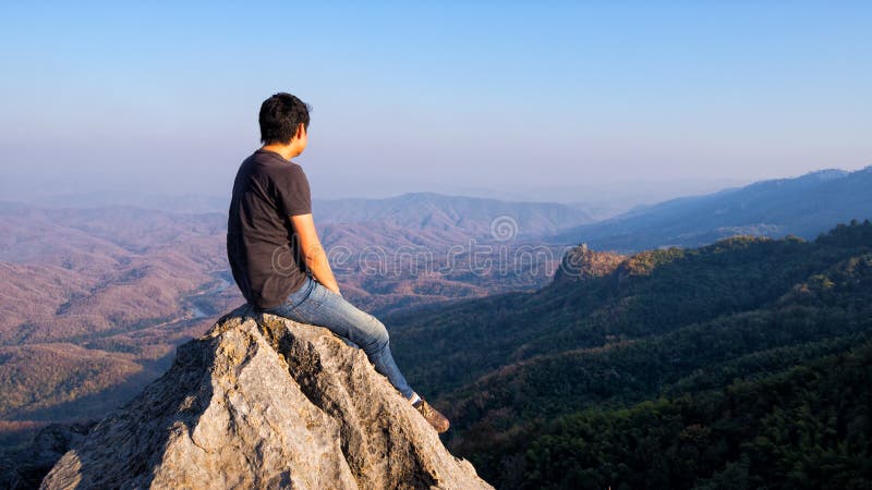 Man on rock at mountain stock image. Image of bright - 37694439