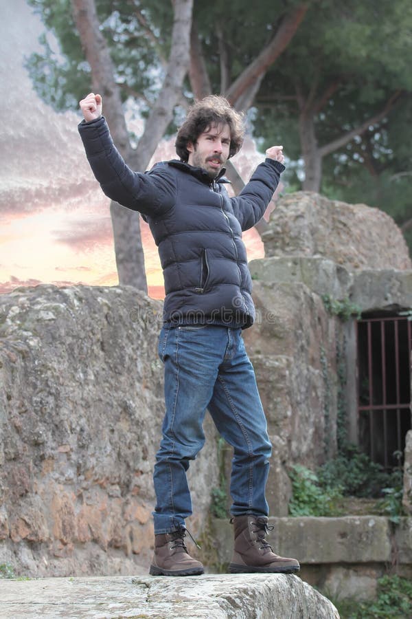 Man on a rock stock image. Image of achievement, cliff - 51668639