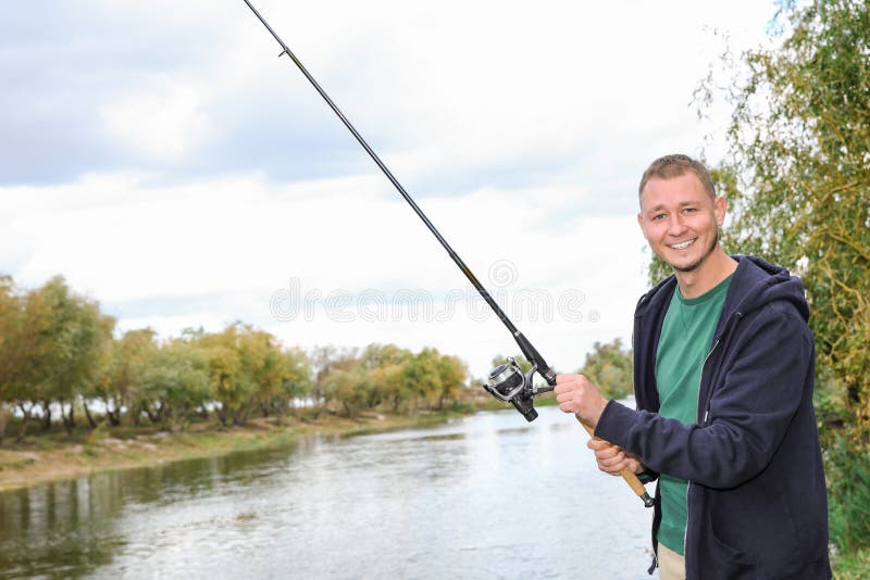 Man with Rod Fishing at Riverside Stock Image - Image of enjoyment ...