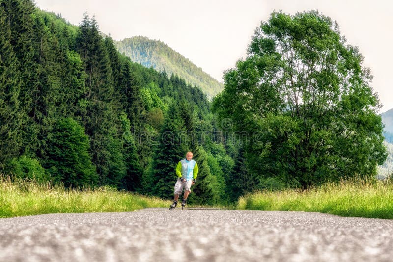 Man on Roller Skates on Asphalt Road Stock Image - Image of country ...